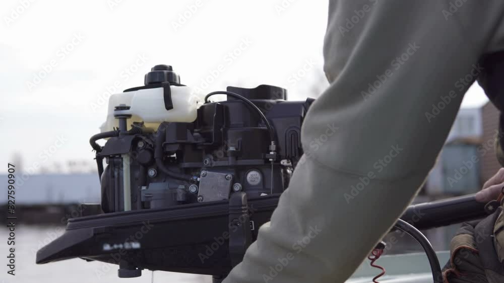 Repair of a four-stroke outboard motor at a service station. Stock ビデオ ...