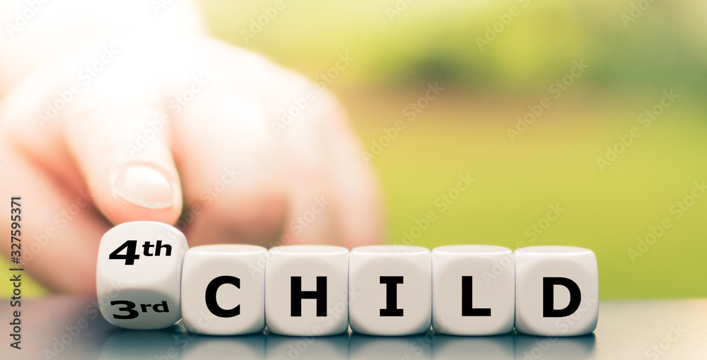 Expecting a second child. Hand turns dice and changes the expression ...