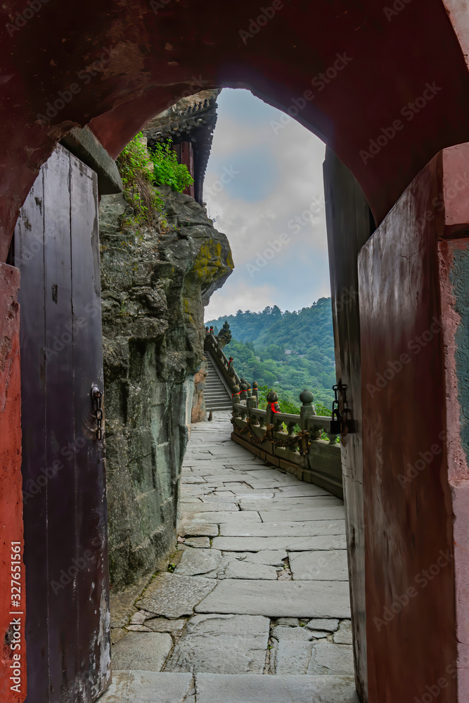 Open door with an arch that leads to Nantianmen path in Nanyan Palace ...