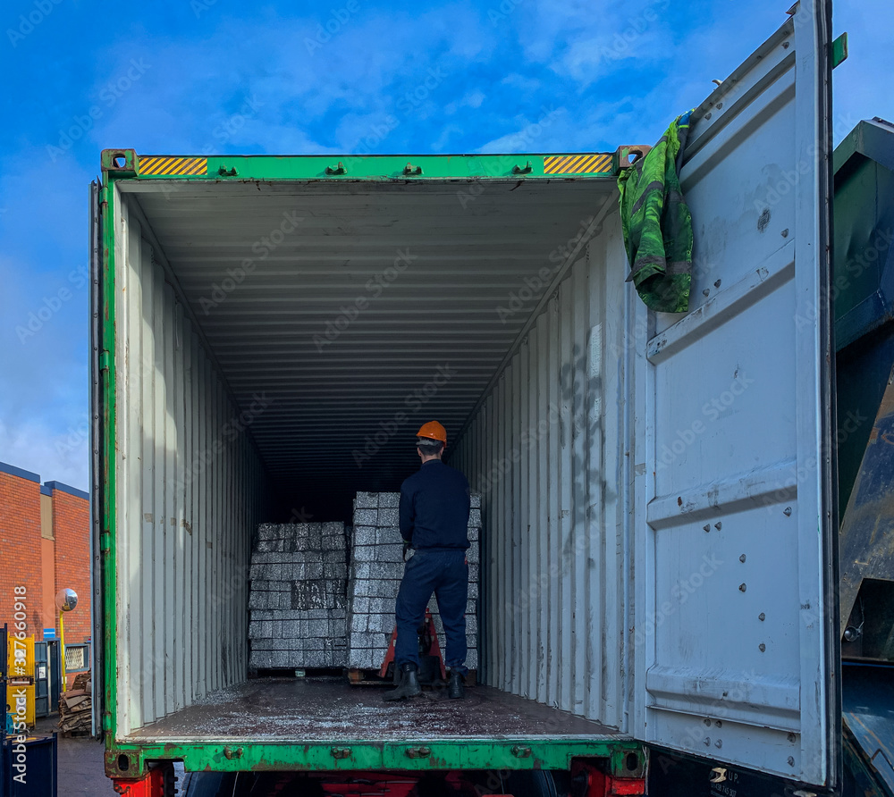 Foto de loading a shipping container with baled aluminium do Stock ...