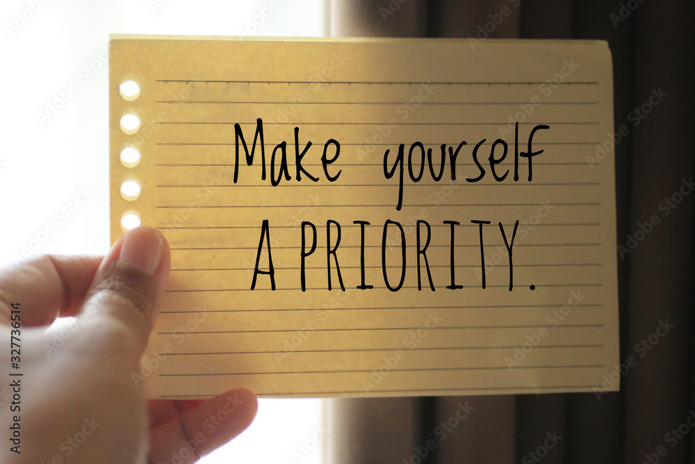 Inspirational quote - Make yourself a priority. With a paper note in ...
