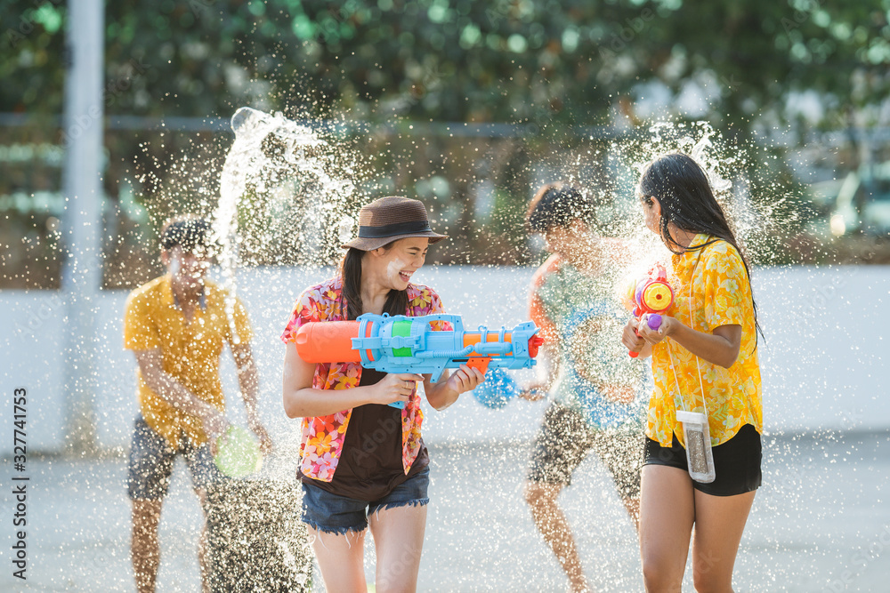 Asian people are using water guns play songkran festival in the summer ...