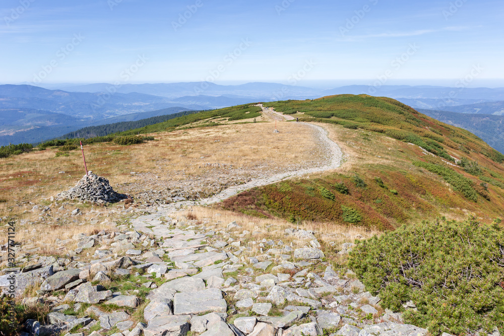 Hiking path to Babia Gora Mountain in Poland under blue sky in summer ...