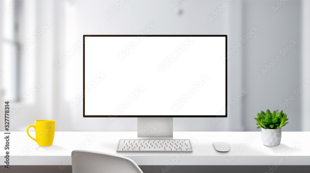 Modern computer display mockup on work desk with thin edges ...