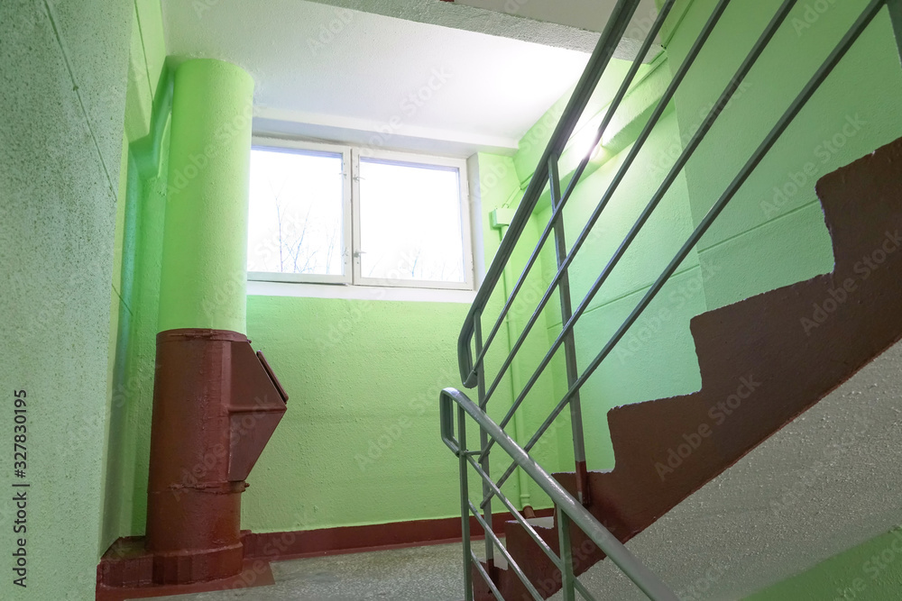 Staircase with a garbage chute inside a residential apartment building ...