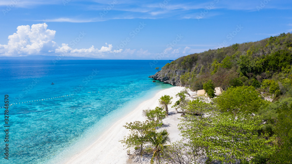 Aerial view of the Sumilon island, sandy beach with tourists swimming ...
