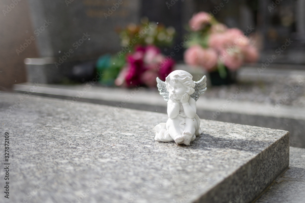 stoned angel at cemetery, graveyard on a bcakground, grave sculpture ...