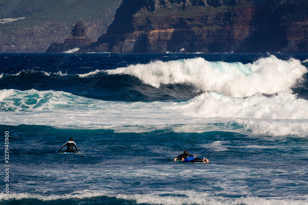Beautiful Surfer spot with big waves surrounded by high cliffs Stock ...