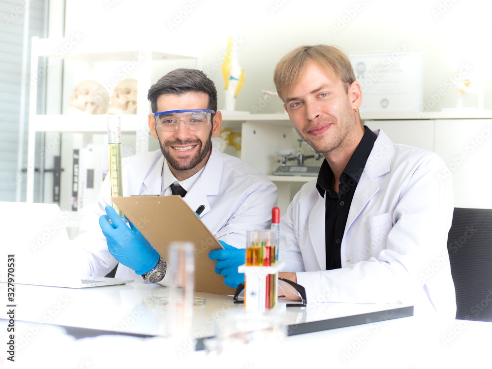 Male scientific team look at camera and smile. Group of researcher ...