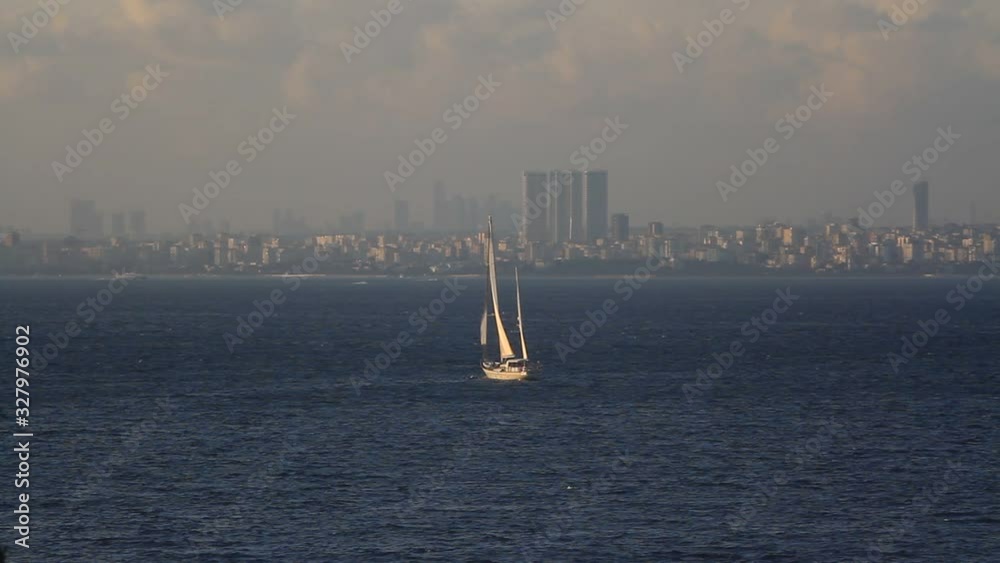 Single masted sailing ship cruising to Istanbul City. Sailing ship ...