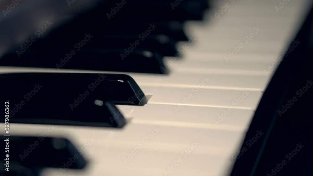 Synthesizer Keyboard. Fingers close on piano keys. Men's hands play ...
