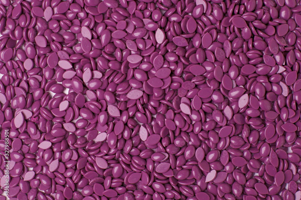 Bright colored granules. Abstract beautiful background. Granules for ...