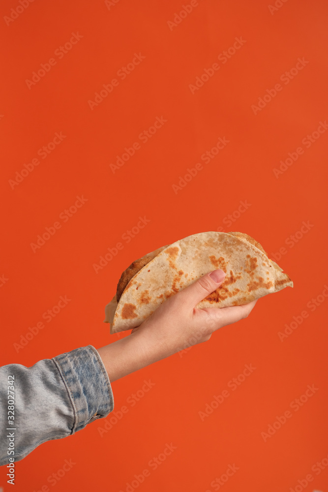 Mexican national food taco or Tatar national food kystyby in hand on an ...