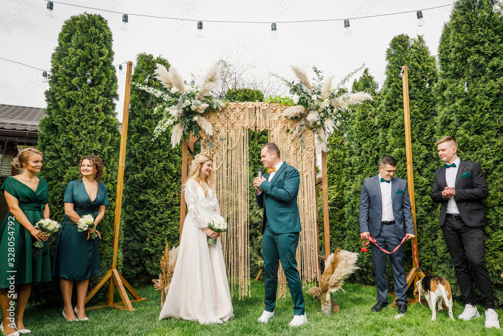 beautiful boho style wedding ceremony. The bride in a beautiful dress ...