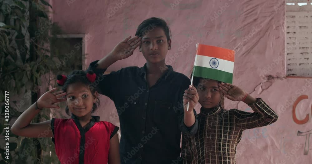 Indian kids raising and wave the Indian national flag or the tiranga ...