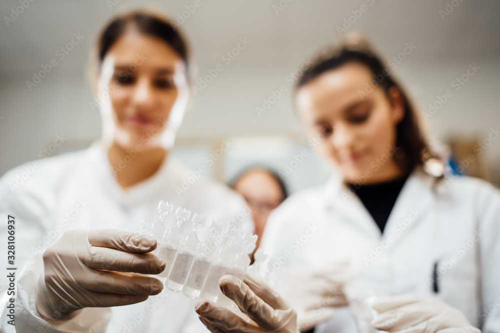 Team of pharmacists developing parenteral antibody antivirus.New ...