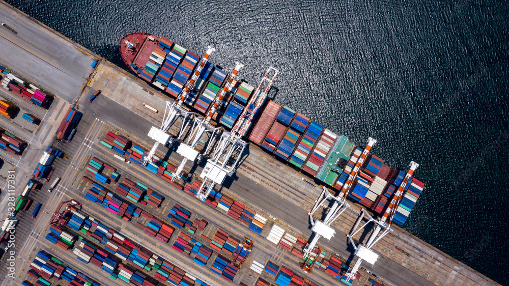 Container ship loading and unloading in deep sea port, Aerial view of ...
