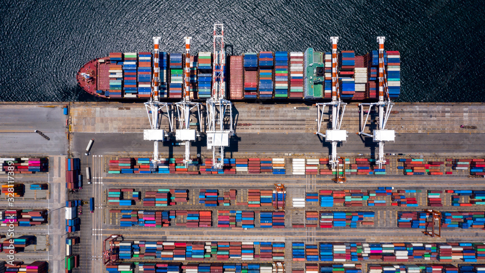 Container ship loading and unloading in deep sea port, Aerial view of ...