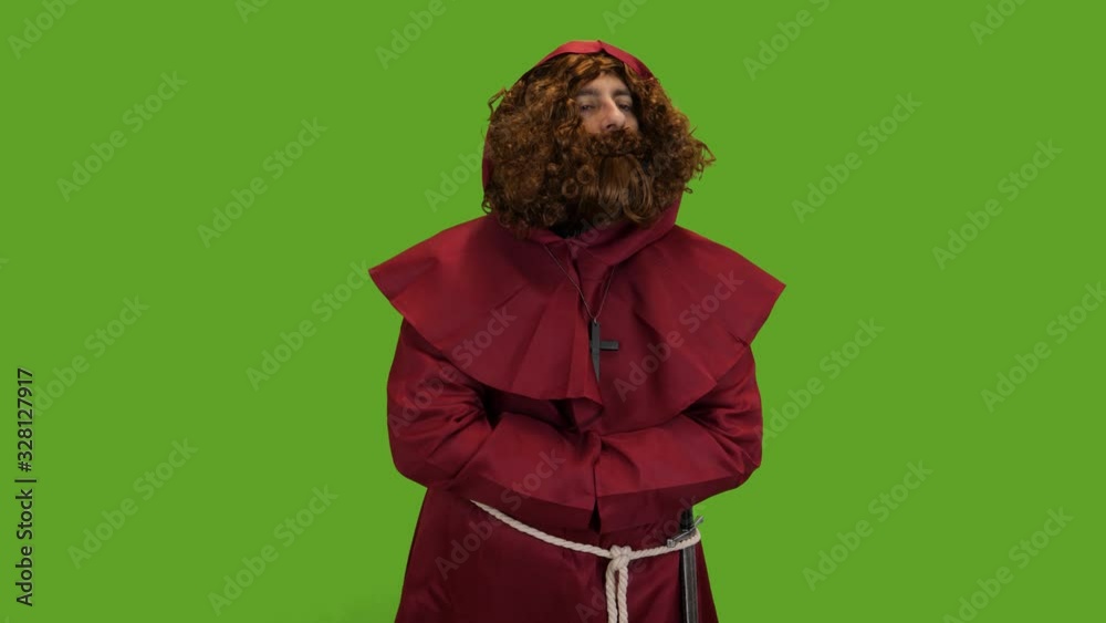 Medieval Bearded priest wearing a sword giving his blessing to the ...