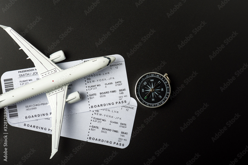 Top view of Jet airliner with boarding pass and compass. Online flight ...