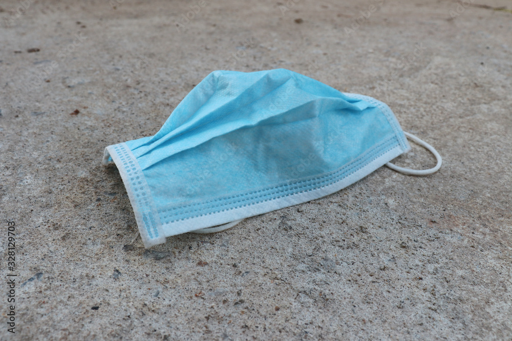 Discard the used hygiene mask to the road with germs and pollution ...
