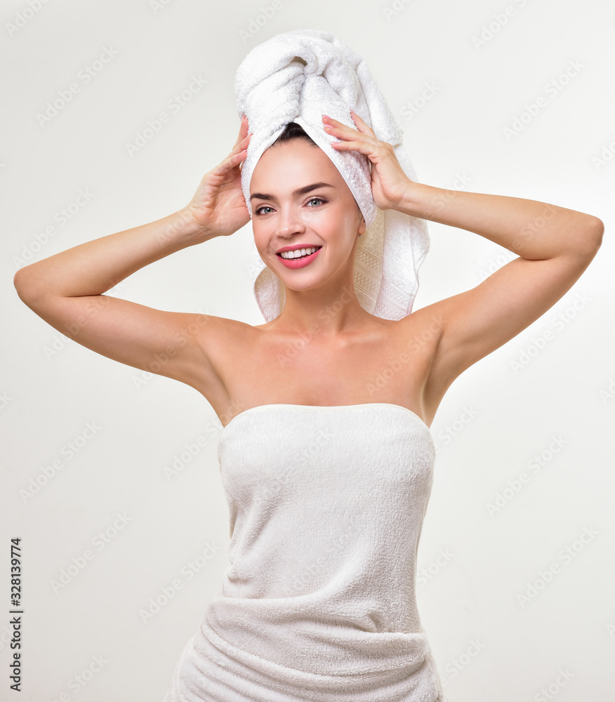 Beautiful young woman holding her arms up and showing clean underarms ...