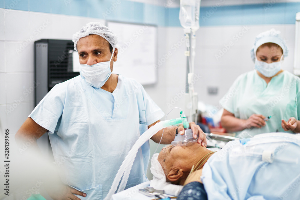 Doctor giving anesthesia to patient Stock Photo | Adobe Stock