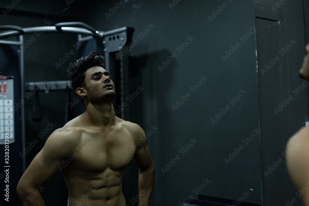 An young and handsome Indian Bengali brunette man with muscular body ...
