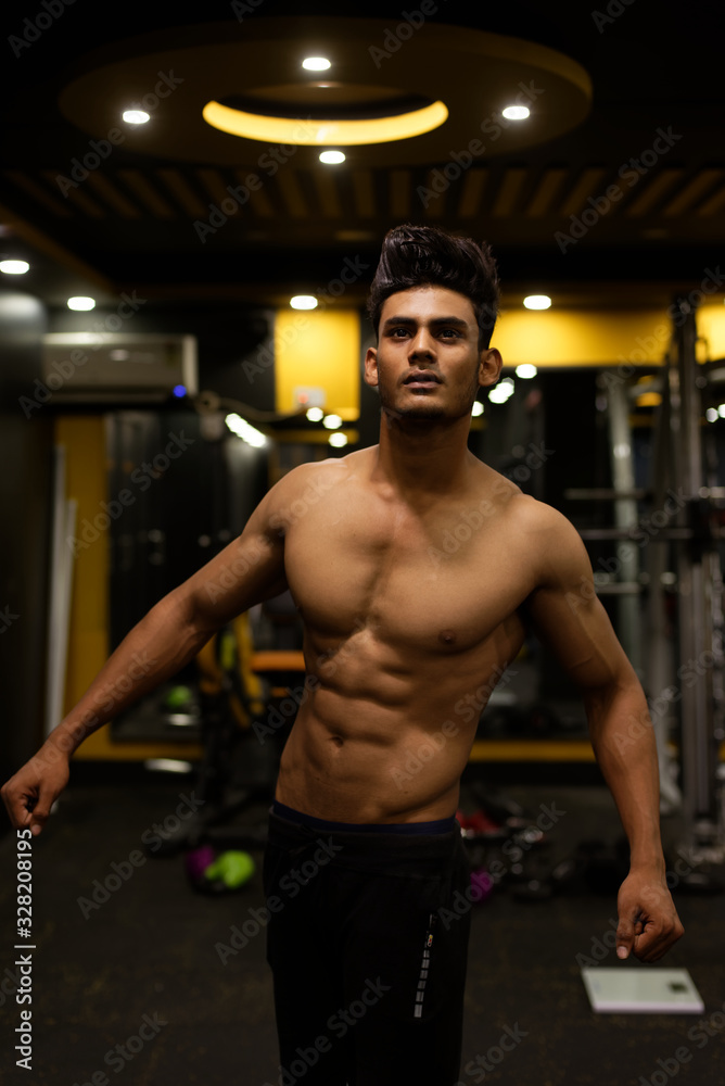 An young and handsome Indian Bengali brunette man with muscular body ...
