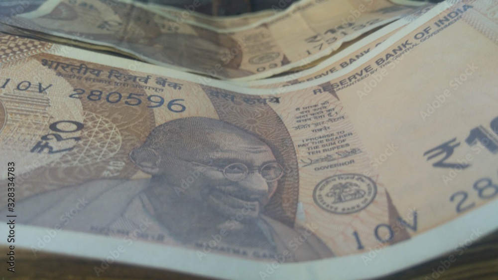 Indian rupees notes with portraits of gandhi. Stock Photo | Adobe Stock