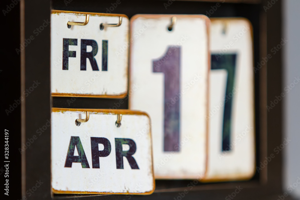a calendar with interchangeable wooden tablets indicating the day of ...