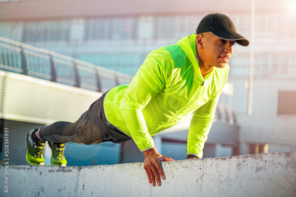Strong young guy doing push ups outdoors. Healthy lifestyle Stock Photo ...