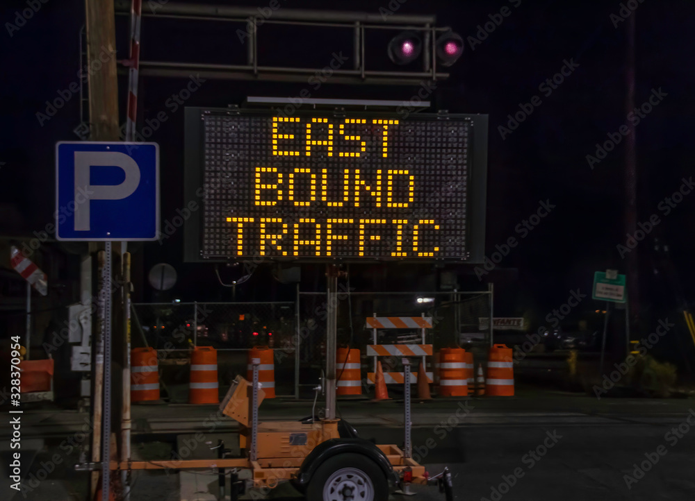 Illuminated elctronic traffic sign in construction site at night Stock ...