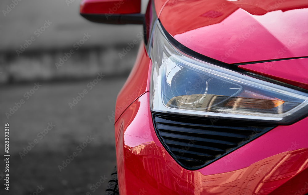 Headlights and hood of sport red car with silver stars Stock Photo ...