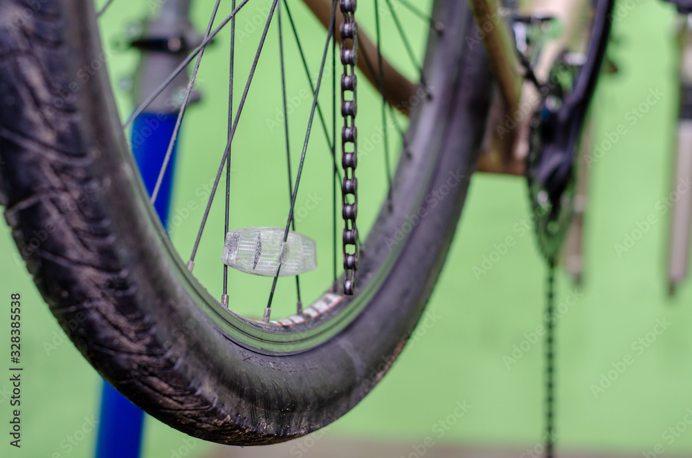 Repair mountain bike in the workshop. Replacing an old rusty chain with ...