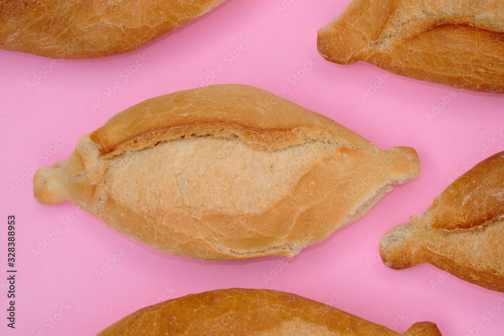 Mexican white bread, traditional Mexican baguette birote on a pastel ...