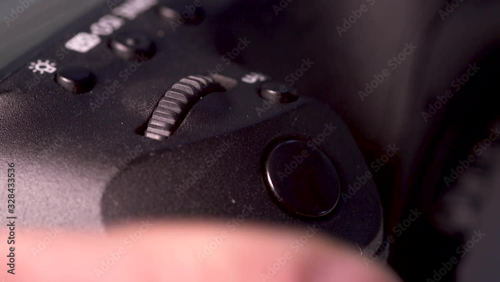 Close up/macro footage of a photographer's finger pushing the button on ...