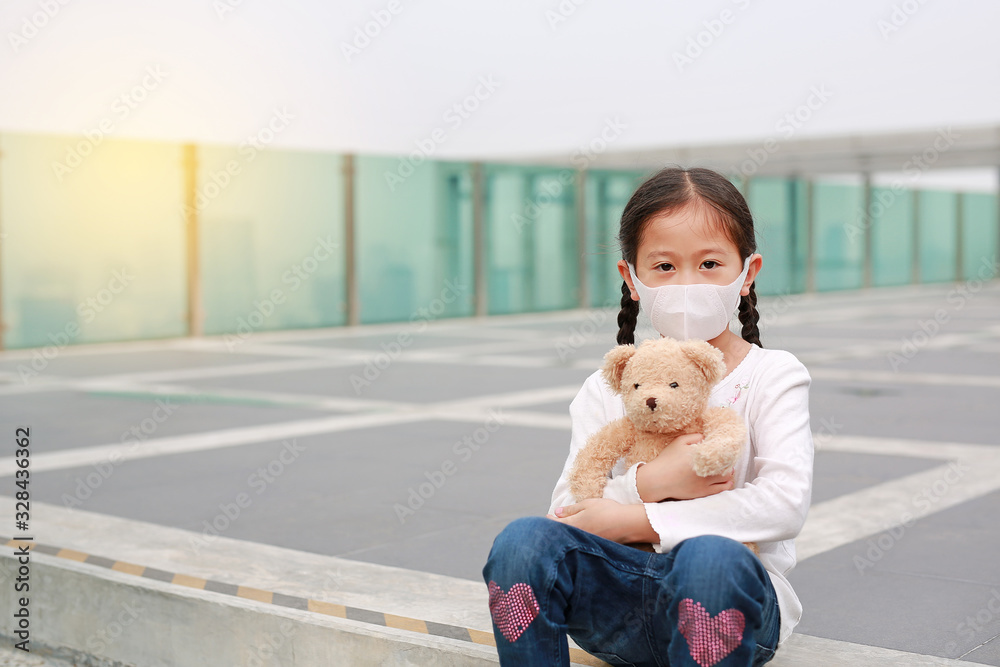 Coronavirus covid-19 and pollution protection concept. Asian little ...