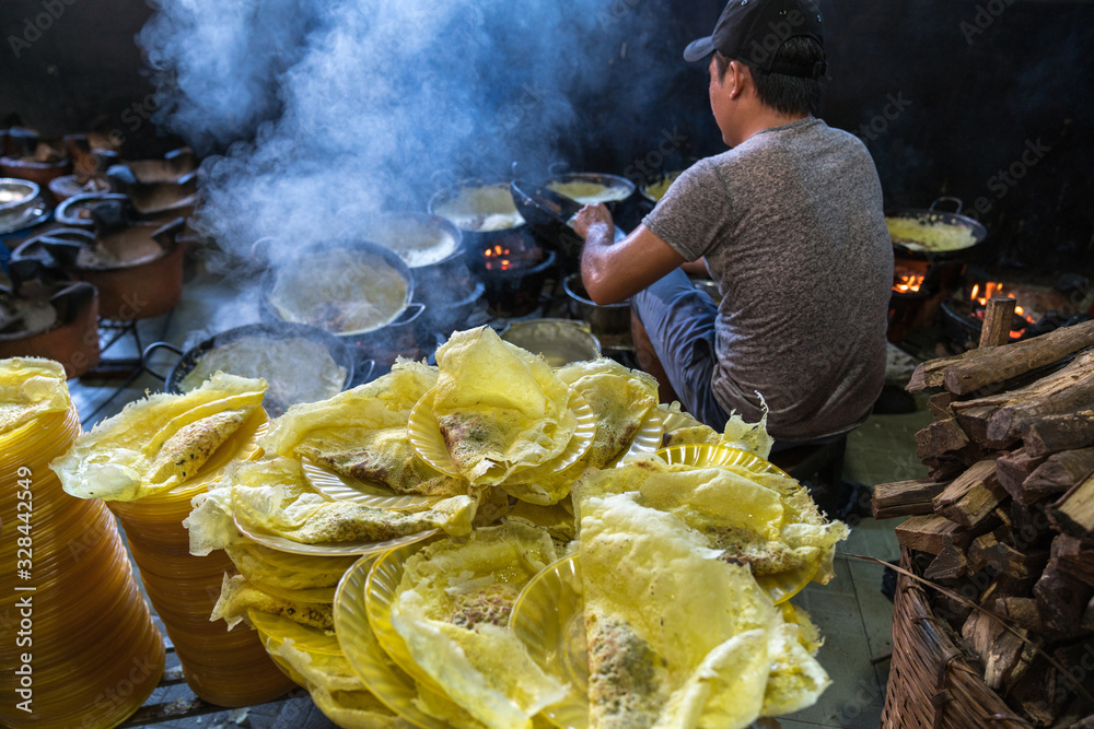 Banh xeo, Vietnamese traditional street food yellow crispy rice flour ...
