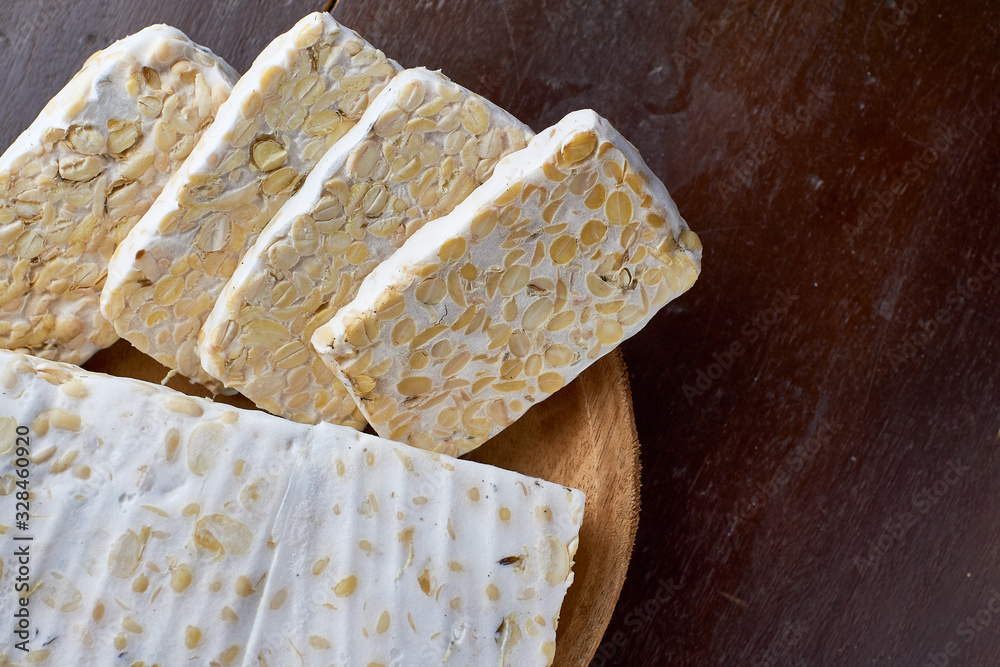 Traditional food of indonesia, Slice of tempeh on the wood background ...