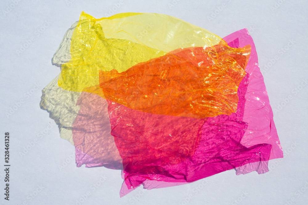 Thin sheet of multi coloured cellophane with shiny crumpled surface ...