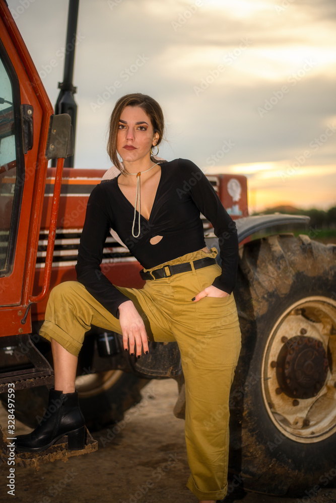 Farm girl on the tractor ready for harvest Stock Photo | Adobe Stock