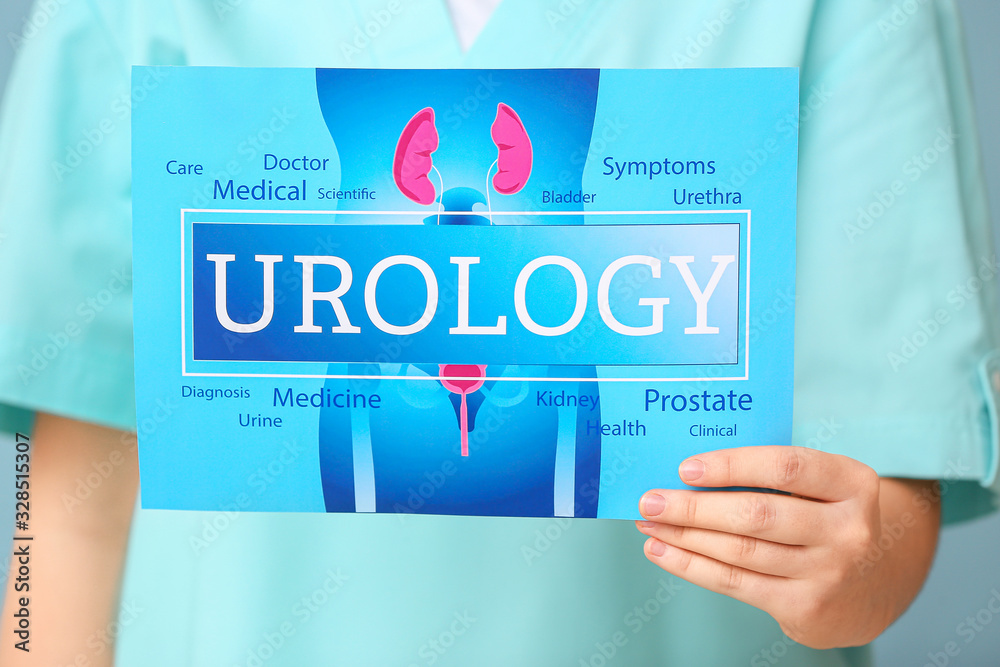 Doctor holding paper with word UROLOGY on color background Stock Photo ...