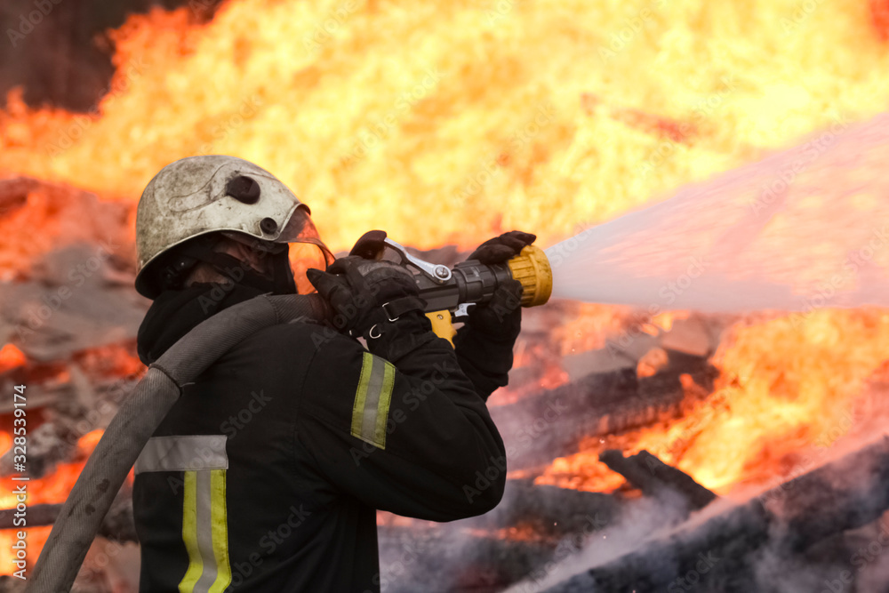 Brave firefighter saving burning building. Firefighter work concept ...