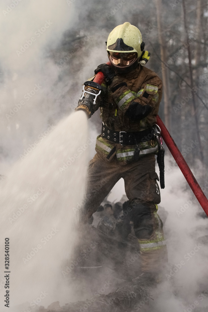 Brave firefighter saving burning building. Firefighter work concept ...