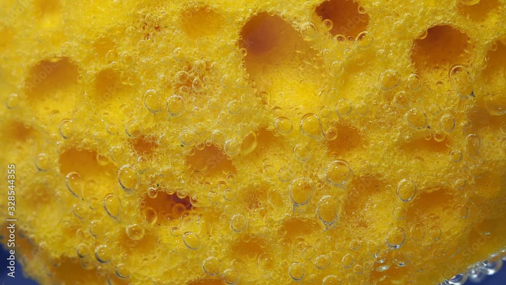 surface of a foam sponge for washing dishes. Porous structure. Cleaning ...