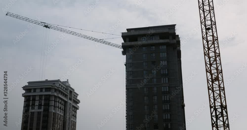 Construction Process of skyscraper with cranes. high rise residential ...