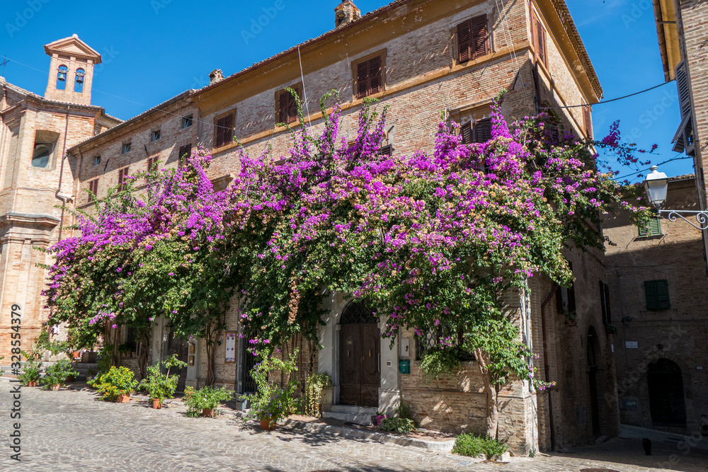 HIstorical center of Corinaldo with stone houses, chucrh, steps and ...