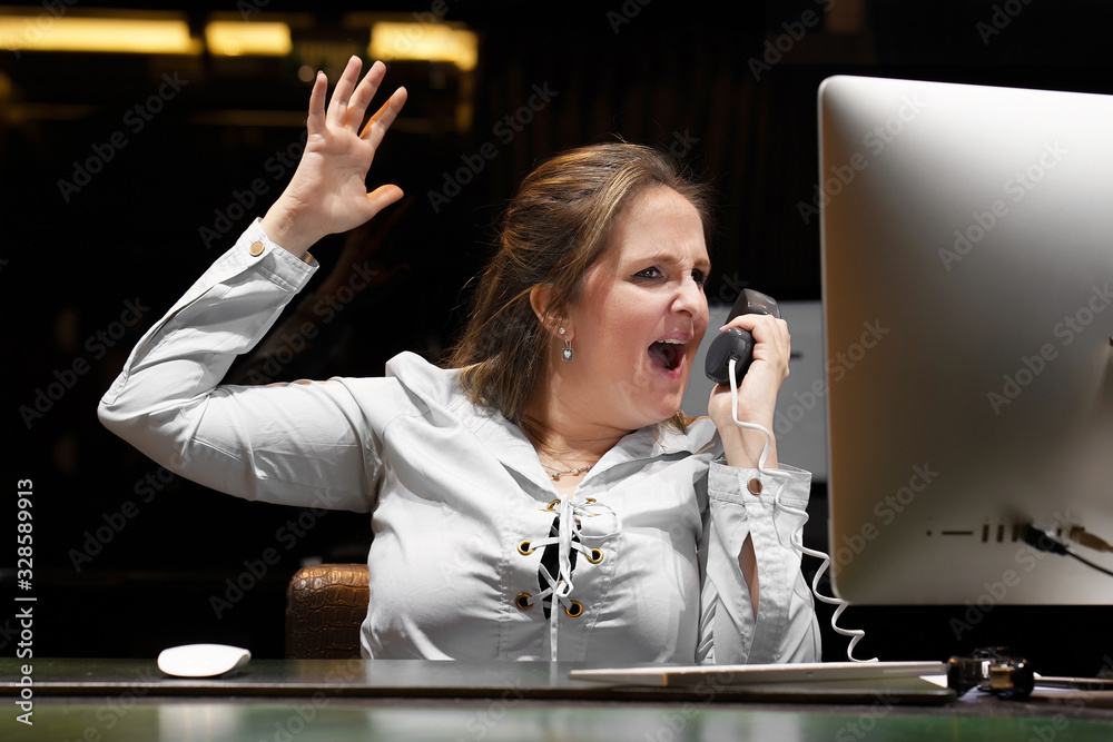 Portrait of office woman in stress. A lot of phone calls in office ...