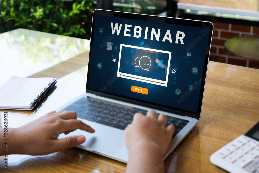 Person using a laptop computer for online training webinars. E-learning ...